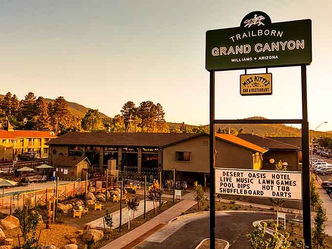 That vintage sign glowing at golden hour proves some welcomes are worth pulling off the highway for.