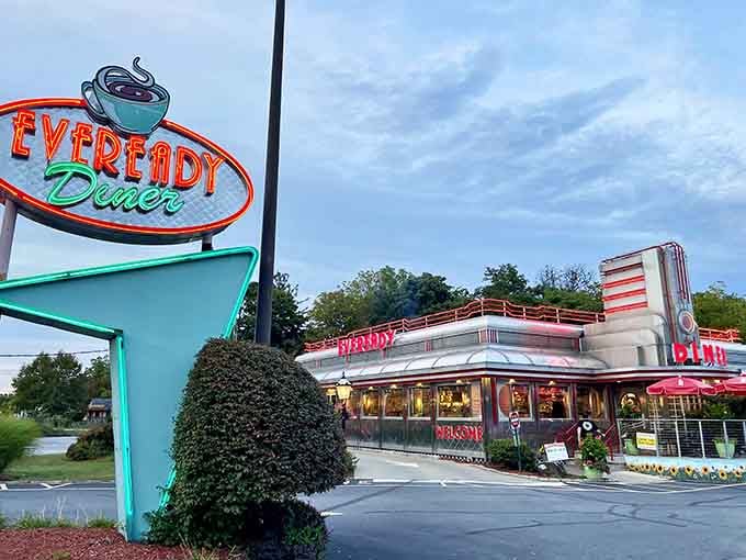 That Art Deco tower and neon glow make this diner look like a spaceship that landed in 1952 and decided to stay.