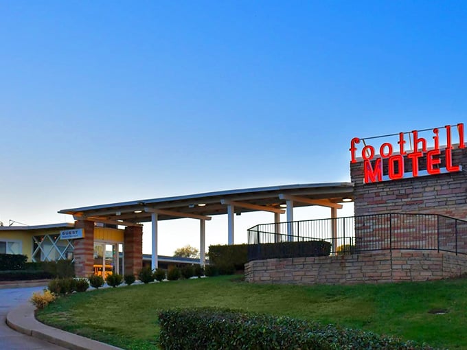 As dusk settles, the Foothills Motel glows like a beacon welcoming weary travelers to simpler times.