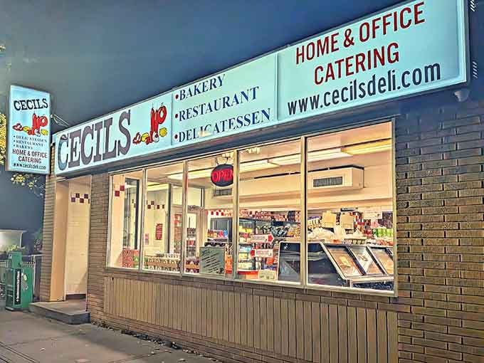 That classic storefront glow promises everything you need: sandwiches, baked goods, and the kind of comfort only a real deli delivers.