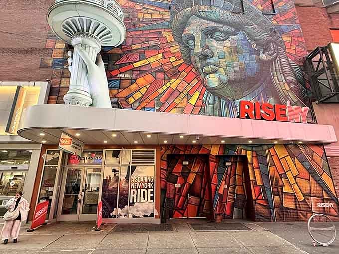 That mosaic mural isn't just eye candy, it's Times Square's most photogenic love letter to Lady Liberty herself.