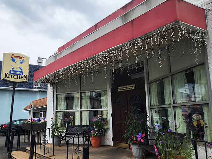That red awning and those twinkling lights make this place look like it wandered off a Bavarian postcard.