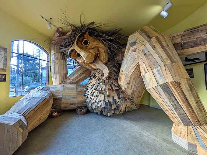 This magnificent wooden giant fills the entire gallery space with reclaimed lumber and pure imagination.