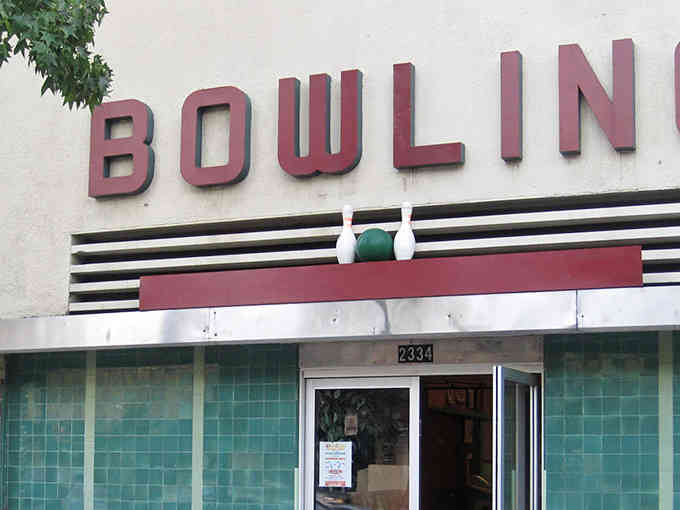 That turquoise tile facade isn't a renovation, it's the real McCoy from bowling's golden age.