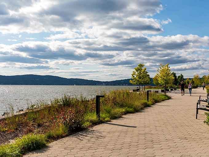 The paved path hugs the shoreline like it was designed by someone who actually walks for pleasure.