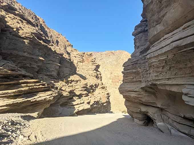 Those layered sandstone walls look like nature's own marble cake, minus the frosting but twice as impressive.