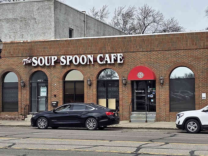 That brick facade with those gorgeous arched windows isn't just pretty architecture, it's your invitation to comfort food paradise.