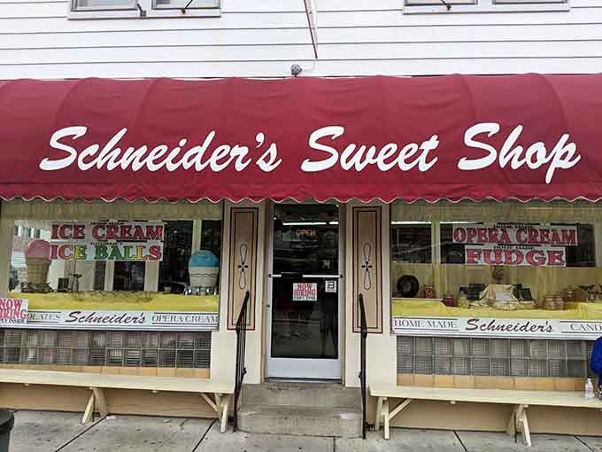That red awning beckons like a lighthouse for sugar-seekers, promising homemade happiness just beyond the door.
