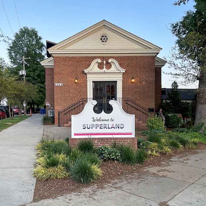 That charming brick facade with the welcoming sign promises unlimited comfort food inside, like finding Mayberry with better cuisine.