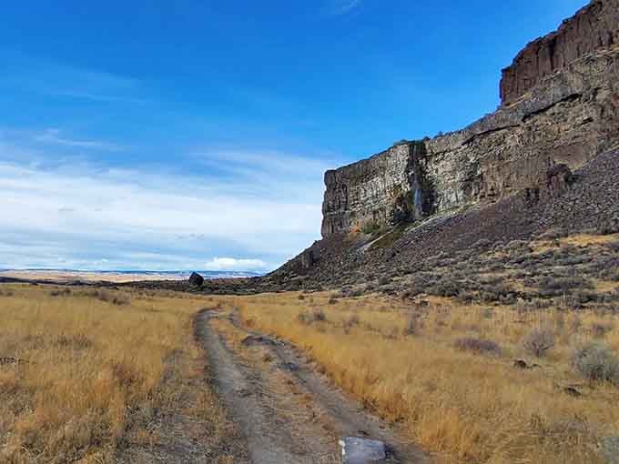 The trail begins where golden grasslands meet towering basalt cliffs&mdash;your adventure into another world starts here.
