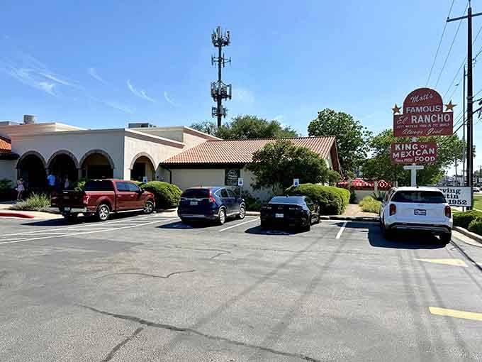 The full parking lot tells you everything you need to know about what's waiting beyond those hacienda-style arches.