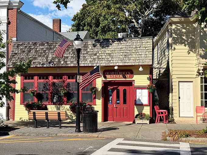 That yellow facade with red trim isn't trying too hard, which is exactly why it works so perfectly.