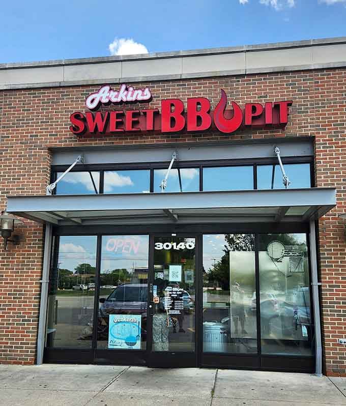 That bold red signage isn't just decoration, it's a promise of smoky perfection waiting inside this Southfield gem.