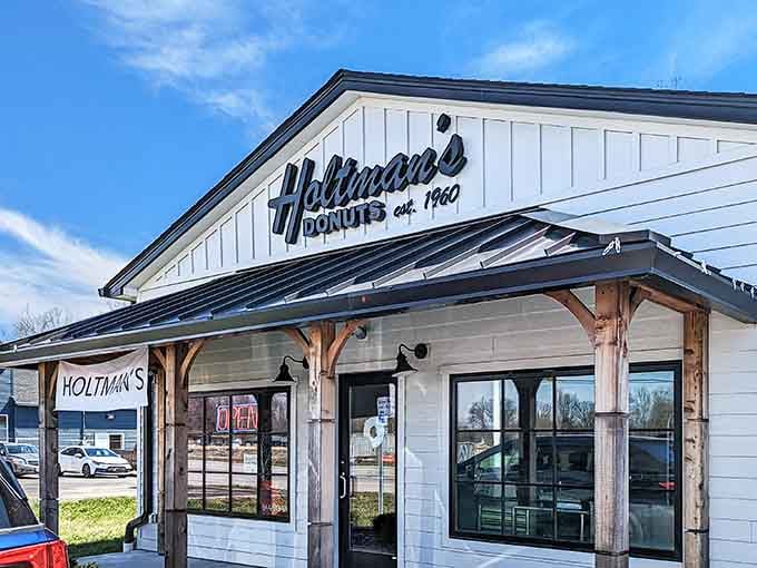 That classic white exterior with the vintage signage isn't just charming, it's a beacon calling donut lovers home.