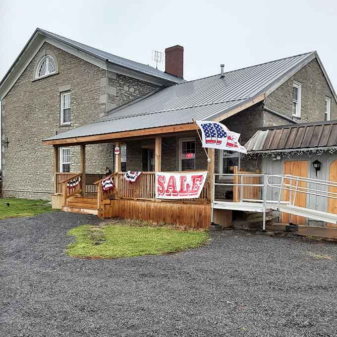 That welcoming front porch isn't just for show; it's your first hint that quality craftsmanship awaits inside this charming stone building.