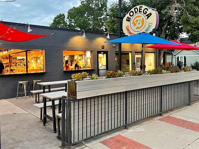 Odie B's Sunnyside welcomes you with vibrant umbrellas and that unmistakable glow of serious sandwich territory ahead.