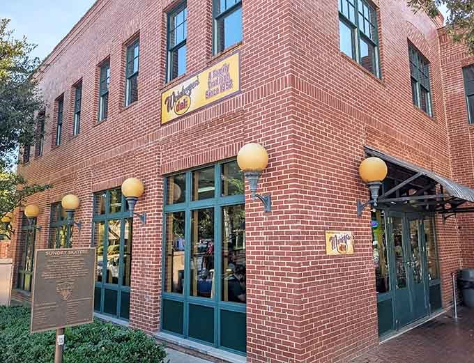 That brick corner building with the cheerful yellow sign is your gateway to sandwich enlightenment in downtown Grapevine.