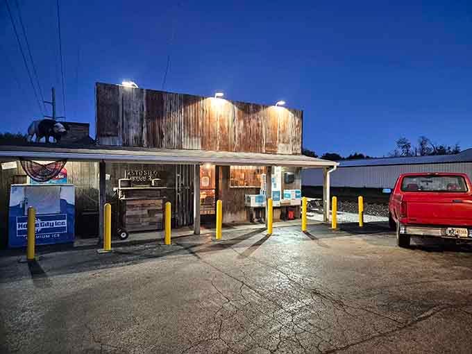 That weathered metal facade glowing under twilight lights looks like a barbecue lover's fever dream come true.