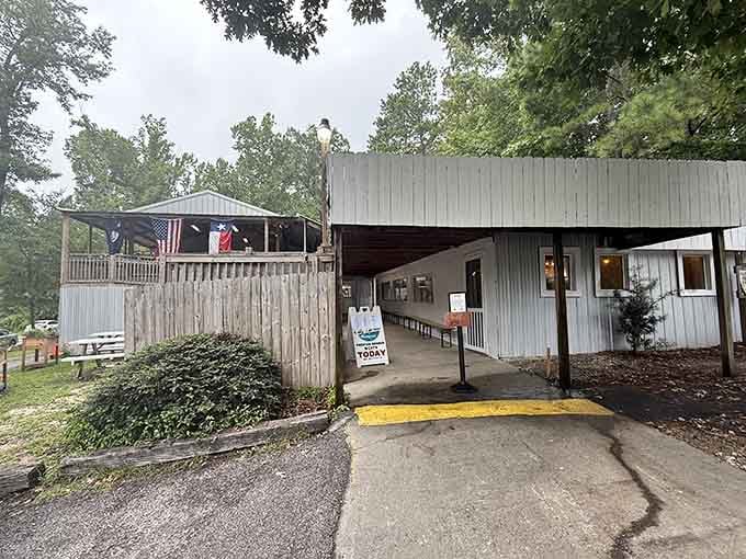 That Texas flag flying proudly tells you everything about the barbecue philosophy here before you even walk in.