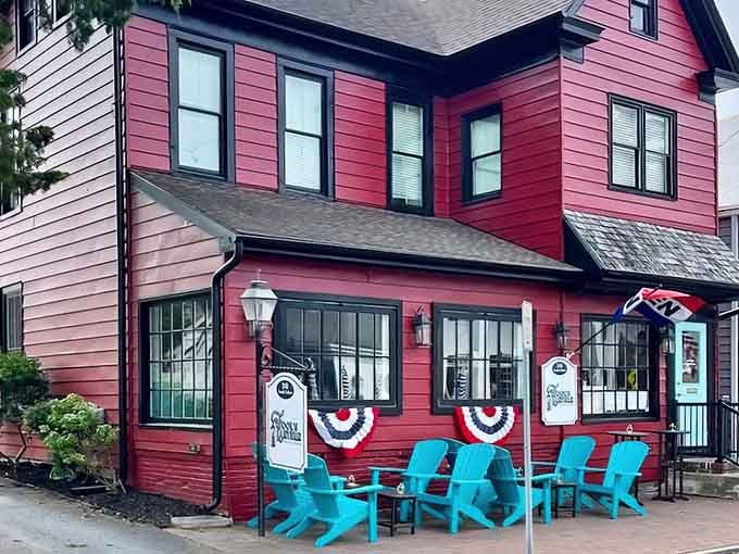 That red facade and those turquoise chairs aren't whispering&mdash;they're shouting "come sit and stay awhile."