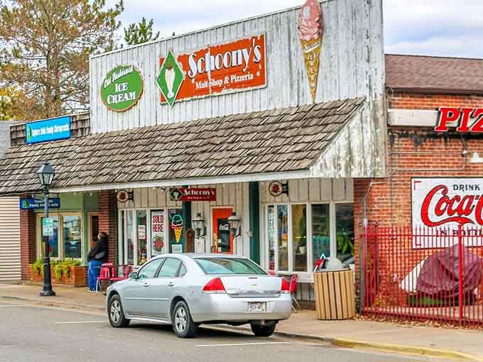 Classic storefronts and vintage signs line streets where time slows down and ice cream becomes a legitimate meal.