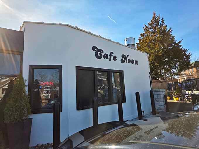That crisp white exterior and charming script lettering practically whisper "come sit, eat, relax" in the afternoon sun.