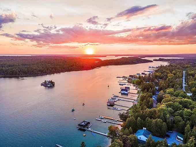 When the sky decides to show off, Les Cheneaux's channels become liquid gold at sunset's grand finale.