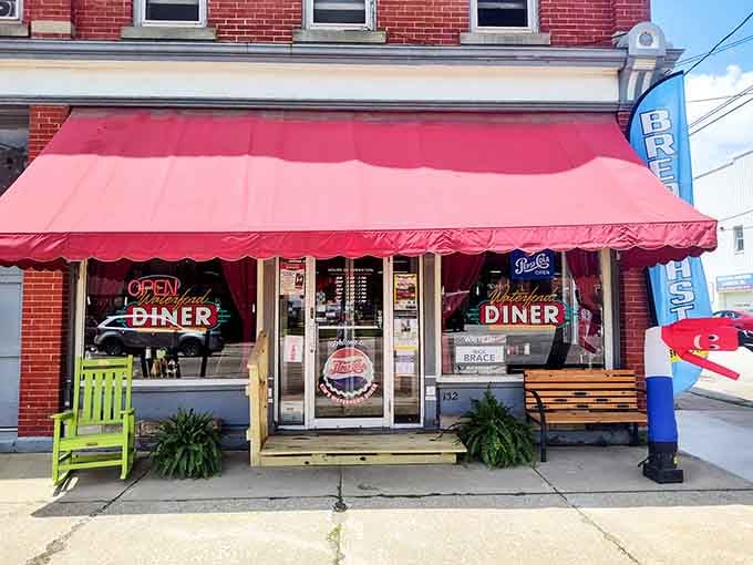 That red awning isn't just decoration; it's a beacon calling you home to breakfast, lunch, and pure diner happiness.