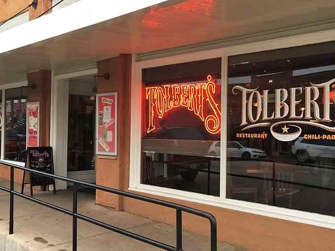 That neon glow isn't just welcoming you in – it's practically giving you a warm Texas hug from the sidewalk.