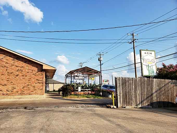 The best enchiladas in Texas hide behind this unassuming facade, where covered patio seating awaits your arrival.