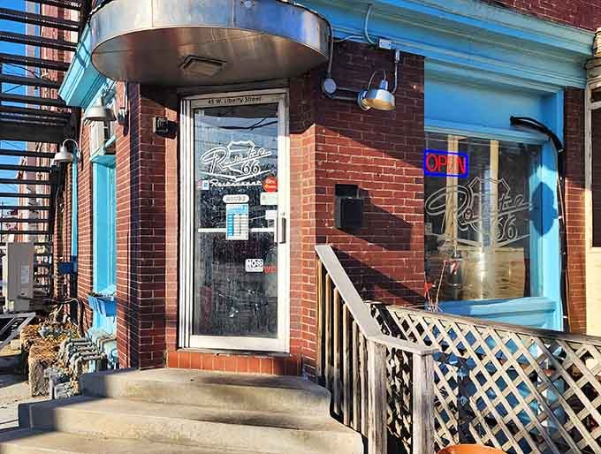 That turquoise trim against red brick isn't just charming, it's practically winking at you to come inside.