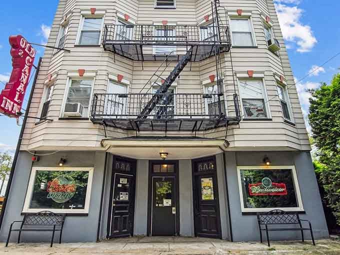 That classic New Jersey corner building charm with fire escapes that have seen decades of neighborhood stories unfold.