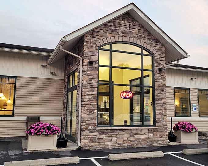 That stone archway and glowing windows promise comfort food and happiness waiting just beyond the threshold.