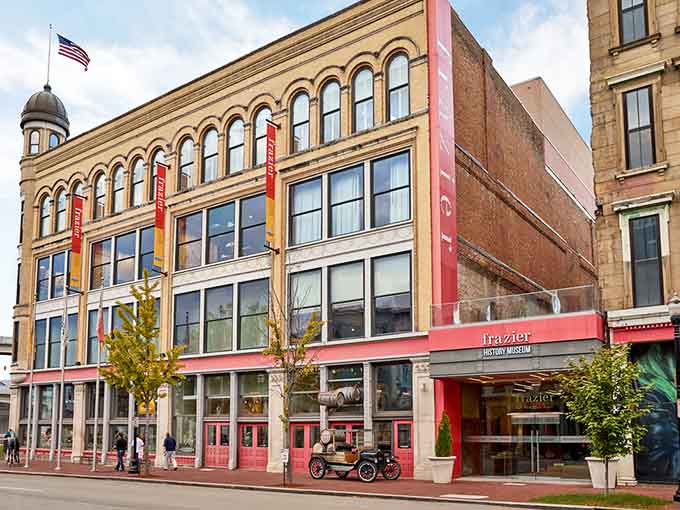 Classic downtown charm meets modern museum magic where those welcoming red doors invite you inside for adventure.