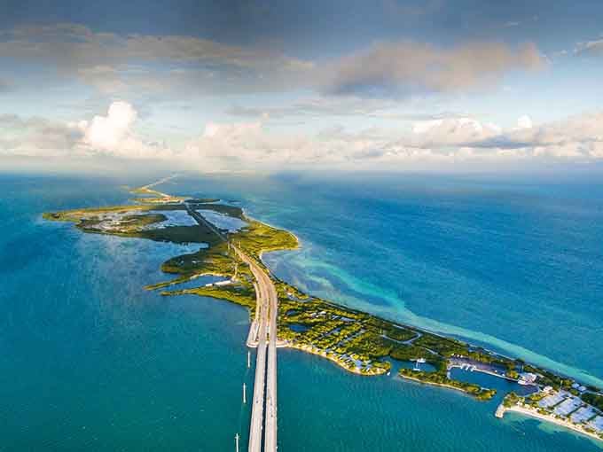 Clouds gather over the highway like nature's own special effects team, proving even dramatic weather improves everything in the Keys.