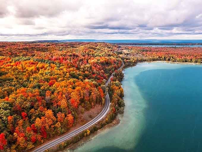 Fall foliage meets turquoise water in a color combination that makes your heart skip a beat along M-22.