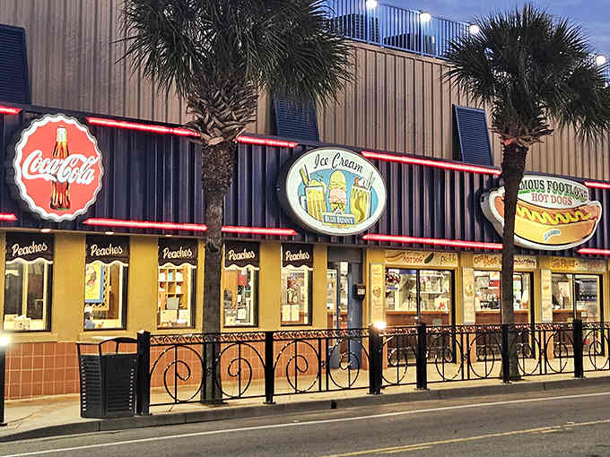 Peaches Corner's neon-lit facade glows like a beacon for burger pilgrims seeking authentic diner magic.