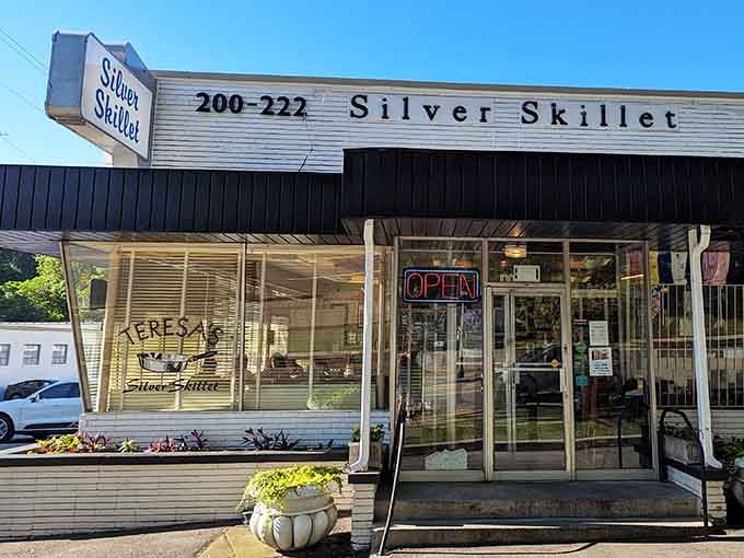 That vintage neon sign isn't just decoration, it's a beacon calling hungry souls to breakfast salvation.