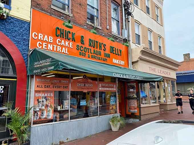 That glowing sign isn't just advertising; it's a beacon calling hungry souls to breakfast paradise and patriotic traditions.