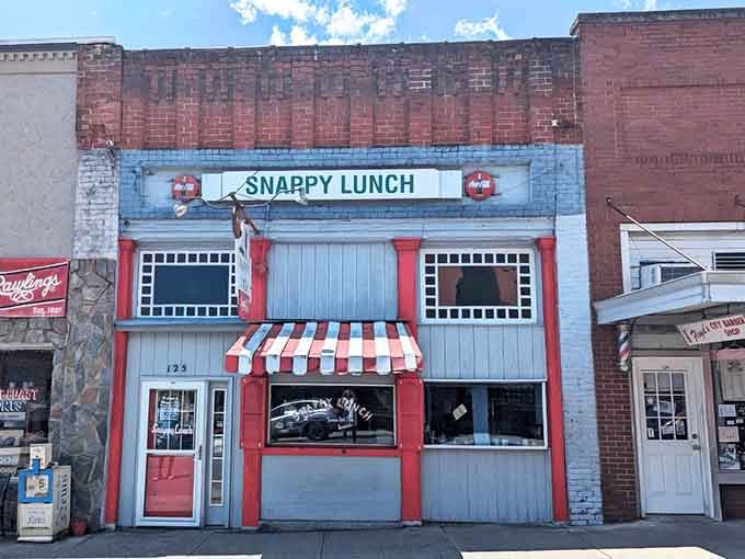 That red and white striped awning isn't just charming, it's been beckoning hungry souls for generations.