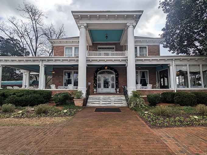 Even under gray skies, this historic mansion stands proud, ready to welcome hungry souls through its elegant doors.