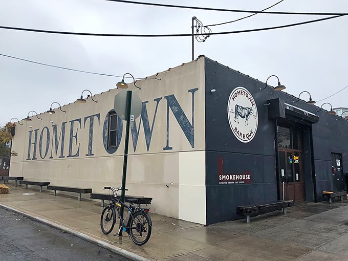 That bold "HOMETOWN" lettering announces your arrival at Brooklyn's smokehouse temple where serious barbecue happens daily.