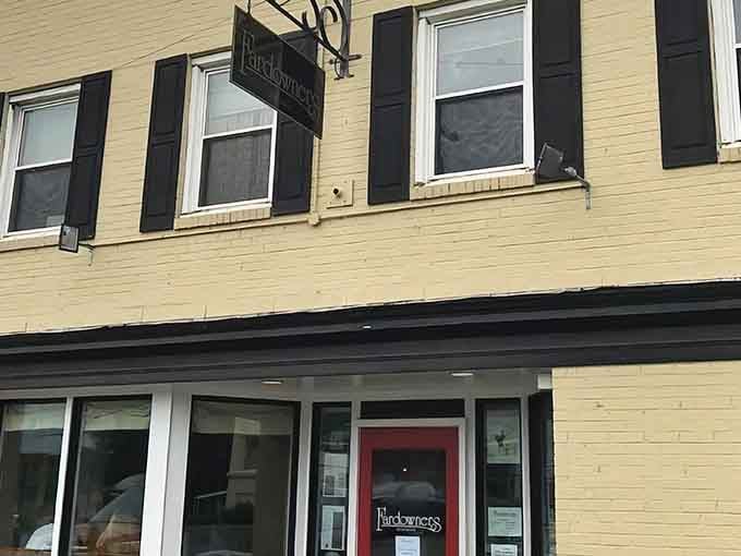 That welcoming red door practically beckons you inside like an old friend waving from the porch.