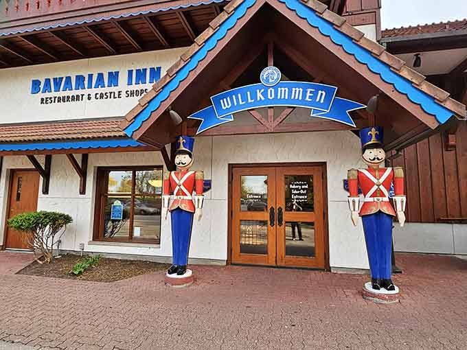 The cheerful sentinels at the entrance promise gemütlichkeit and generous portions just beyond those welcoming doors.