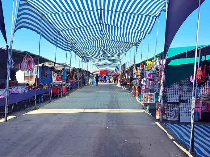 Those blue-and-white striped awnings stretch out like a welcoming canopy over endless possibilities and weekend adventures.