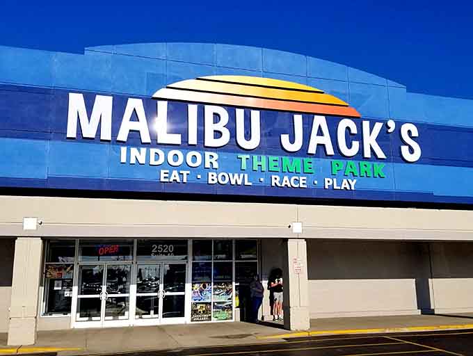 That colorful sunset logo promises exactly what's inside: a full day of eating, bowling, racing, and playing under one roof.