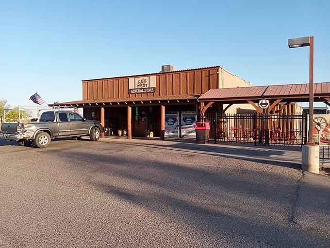 That weathered wooden facade with the American flag waving proudly looks like something straight out of a classic Western movie.