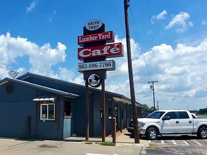 That classic roadside sign towers over the blue metal building like a beacon calling hungry travelers home to comfort food.