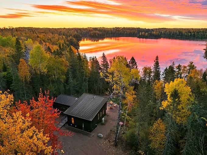 Sunset paints the sky like a cosmic artist showing off, while this modern cabin sits pretty among fall's finest work.