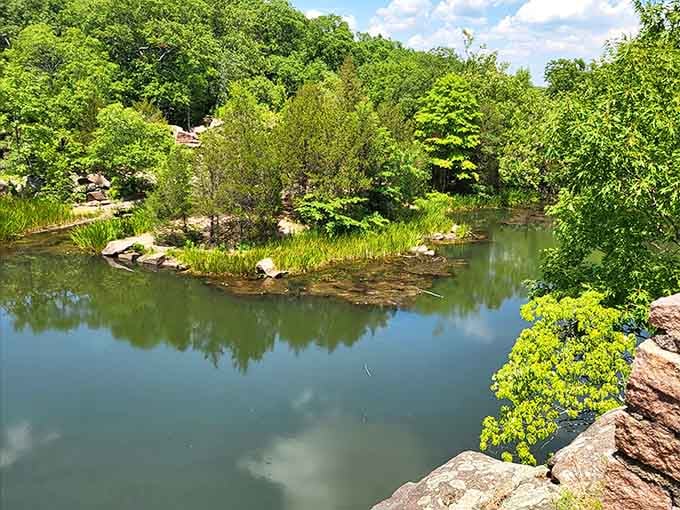 Nature's mirror game is strong here, where water reflects sky and trees create their own masterpiece daily.